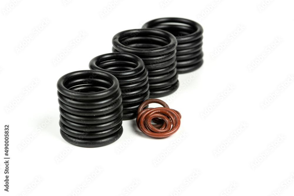 Hydraulic and pneumatic o-rings in black in different sizes on a white ...