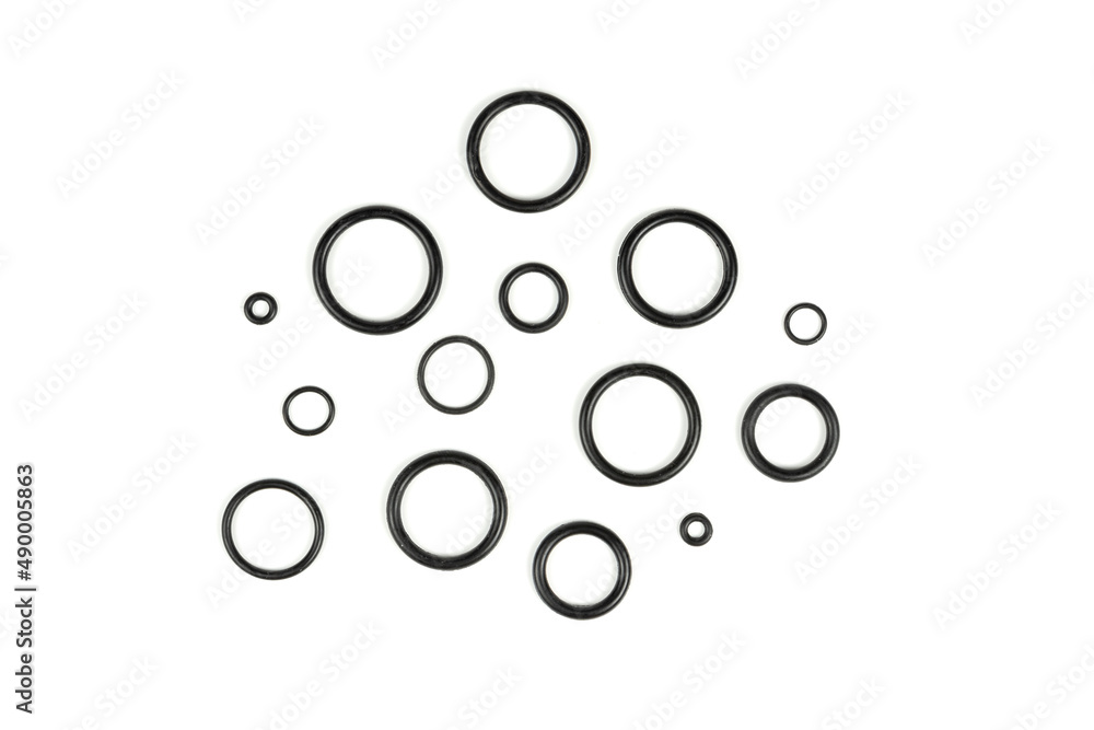 Hydraulic and pneumatic o-rings in black in different sizes on a white ...