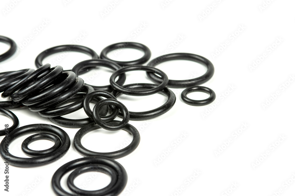 Hydraulic and pneumatic o-rings in black in different sizes on a white ...