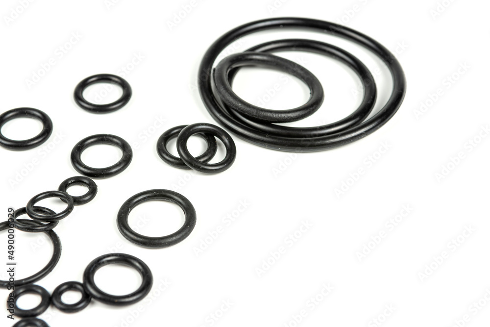 Hydraulic and pneumatic o-rings in black in different sizes on a white ...
