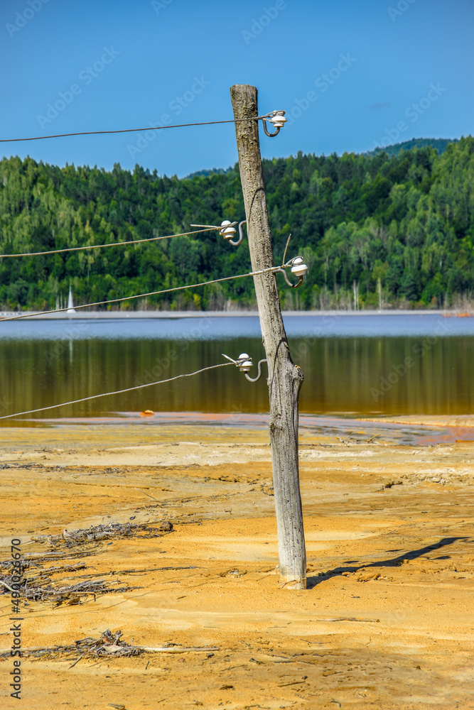Electric pole buried in poison from a gold mine - pollution Stock Photo ...