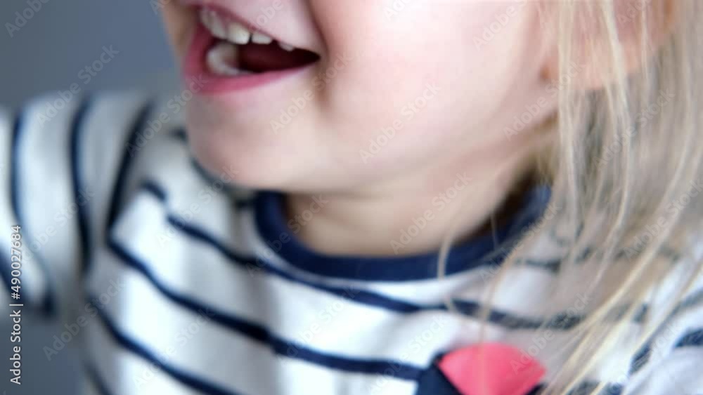 cheerful child, girl 2 years old laughing, close-up of part of child's ...