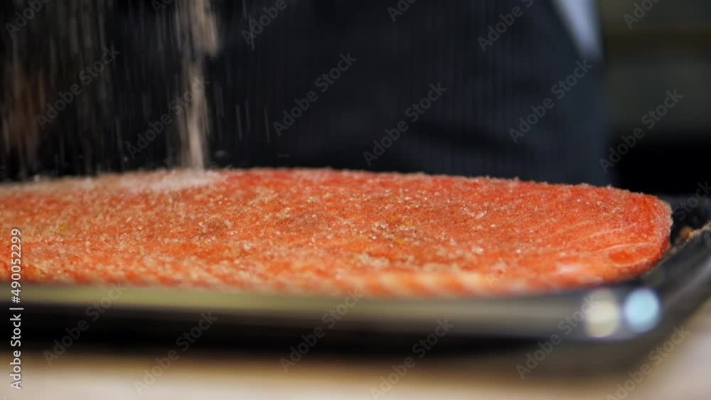 fillet of red fish, large piece. salted filler close-up on a dark ...