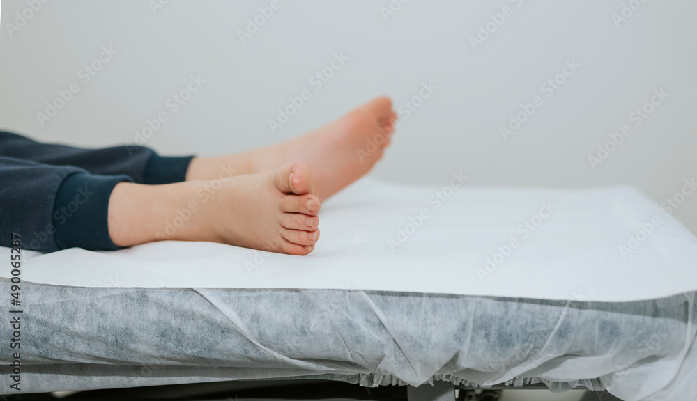 Plan of a child's feet on a physiotherapy table Stock Photo | Adobe Stock