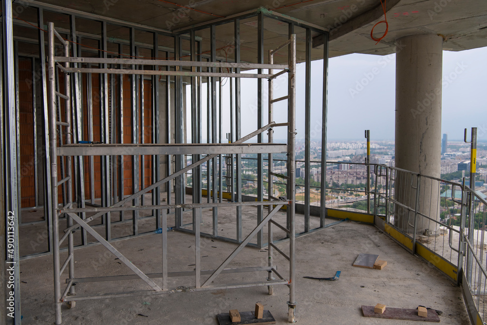 Movable scaffolding inside the floor of high rising building skyscraper ...