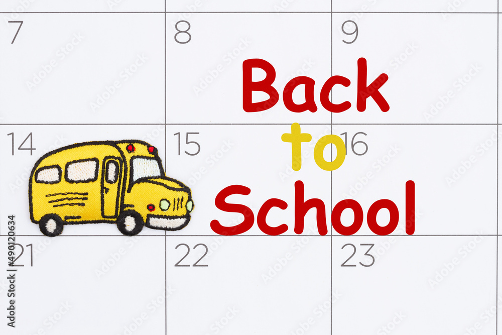 Going back to school schedule message on a calendar with a school bus ...