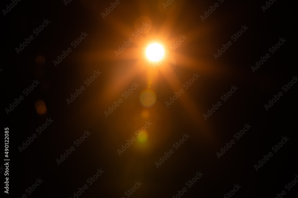 Solar lens flare on black background Stock Photo | Adobe Stock