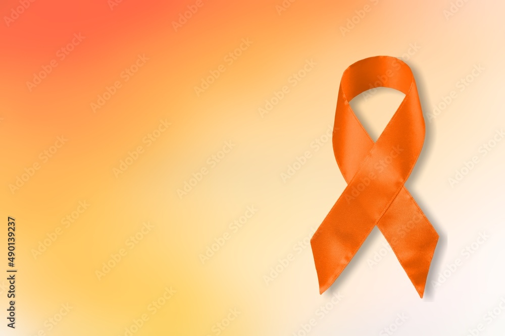 Poster February awareness month campaign with orange ribbon on the desk ...