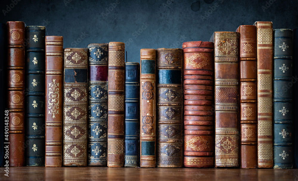 Old antiques books on wooden shelf. Tiled Bookshelf background. Concept ...