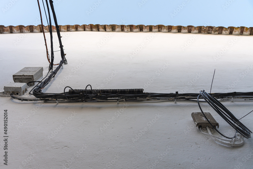 Electrical connections on the exterior facade of old houses, high ...