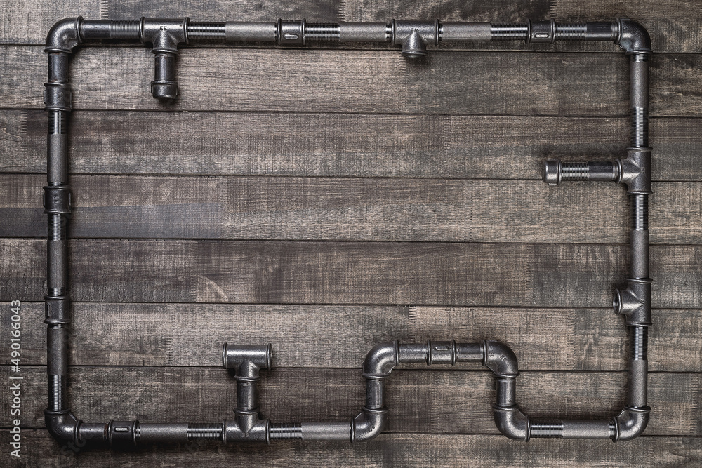 Frame. Background. Cast iron pipes and fittings of different shape ...