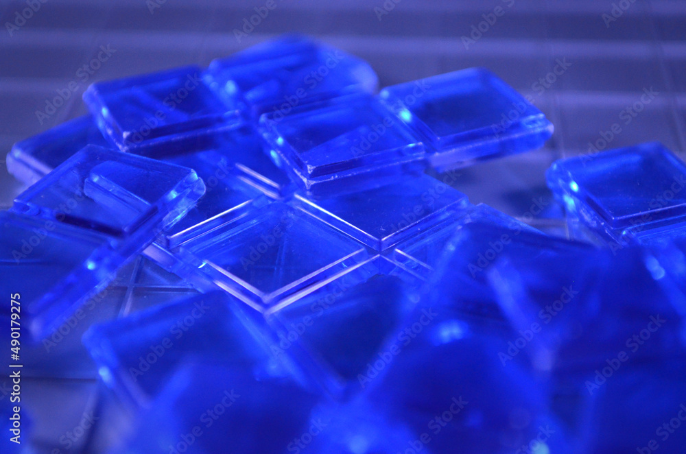 Blue Plastic Pieces on a Grid | Plastic Tiles | Plastic Pieces Photos ...