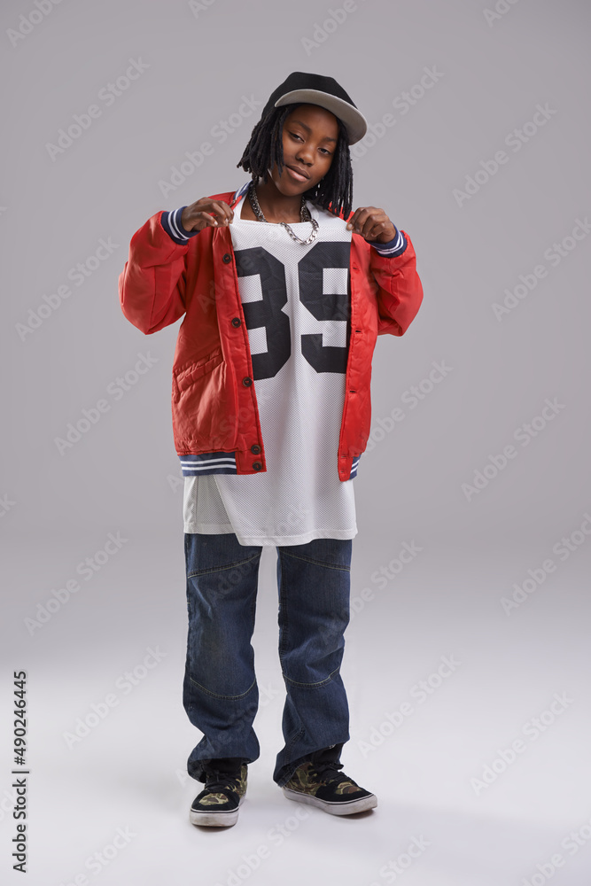 The ladies love me. Studio shot of a young boy dressed in hip hop ...