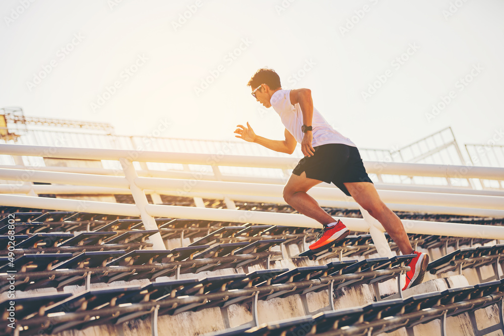 Young woman running sprinting up stairs. Fit runner fitness runner ...