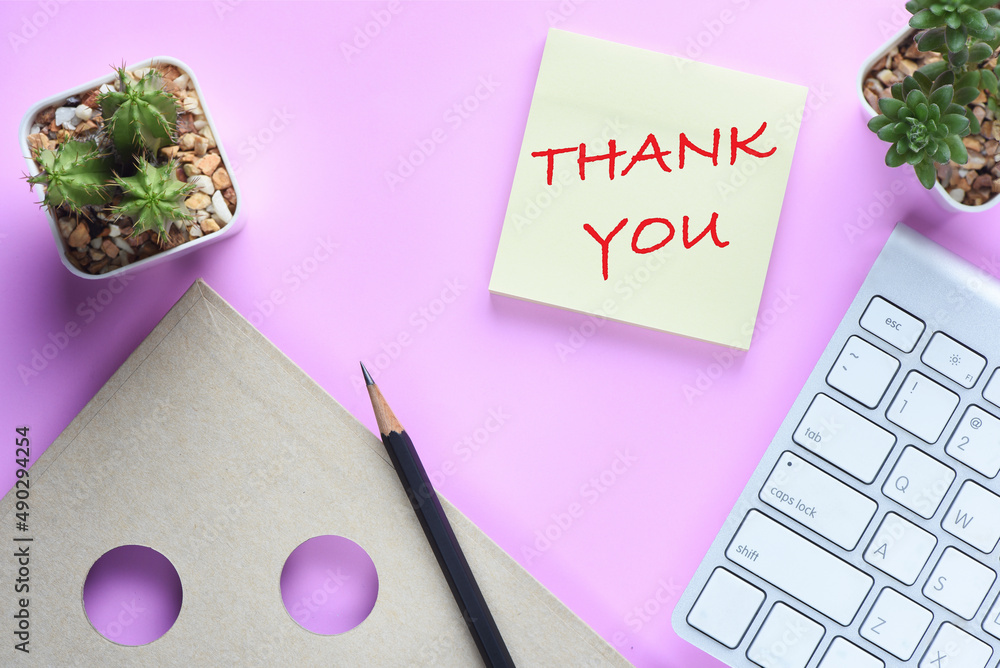 Thank you written on sticky notes on modern desk. Communication with ...