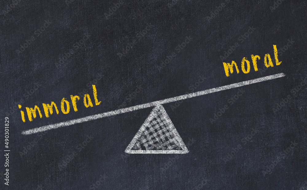 Chalk drawing of scales with words immoral and moral. Concept of ...