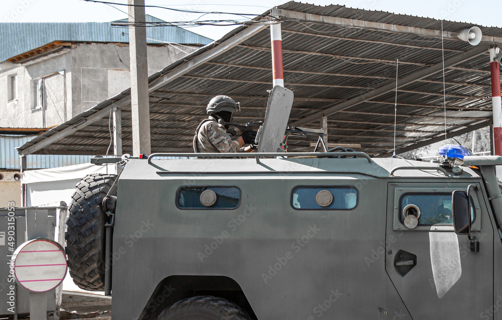 Military operations in Ukraine. A soldier with a machine gun on the ...