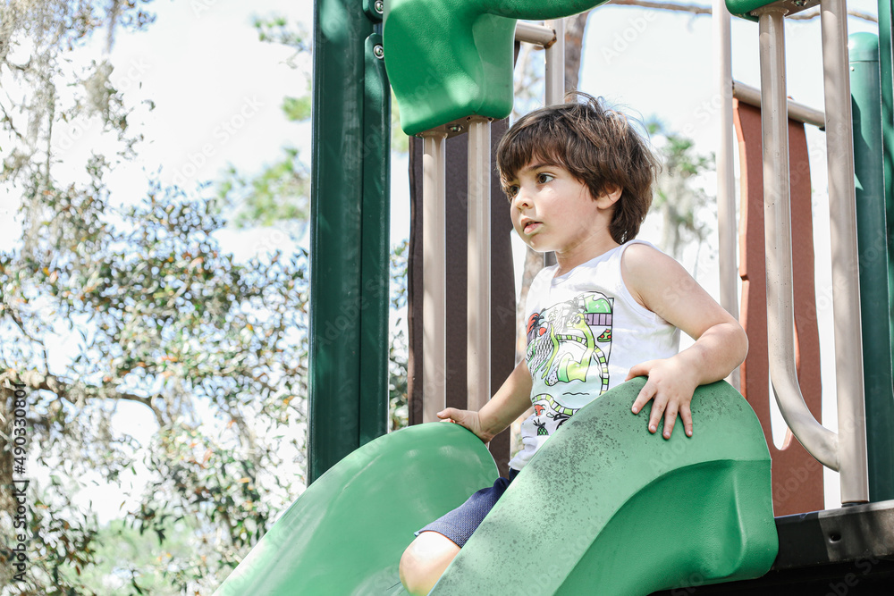 Child Playing In The Playground Of Moss Park In Orlando Florida Moss child-playing-in-the-playground-of-moss-park-in-orlando-florida-moss