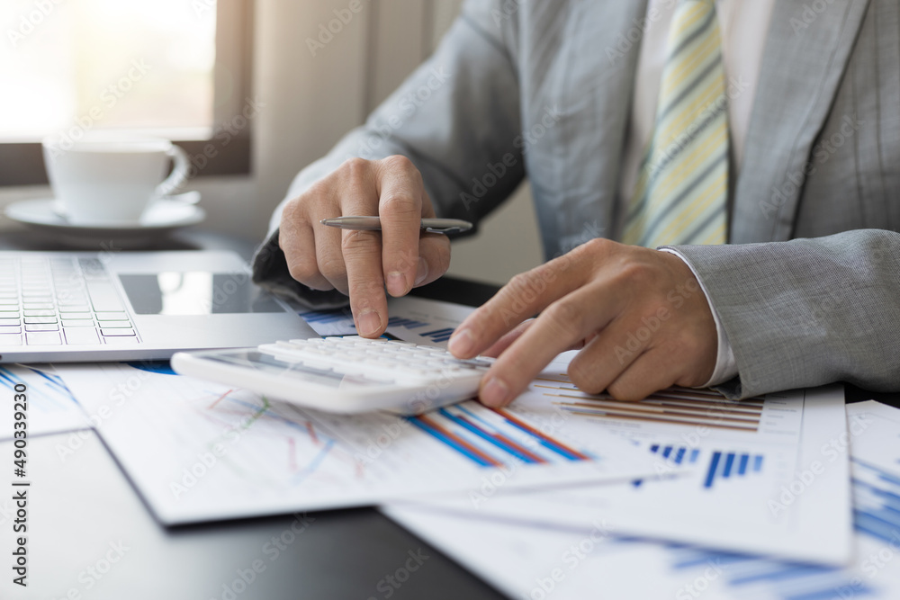 Accountant or banker making calculations. Savings, finances and economy ...