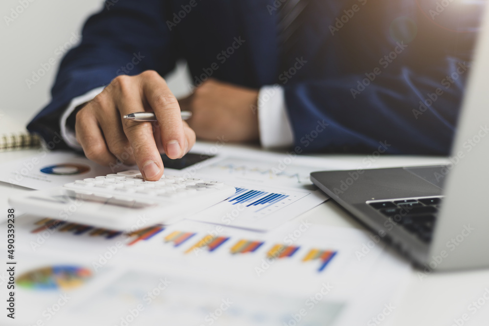 Employee accountant man hand press on calculator for make financial ...