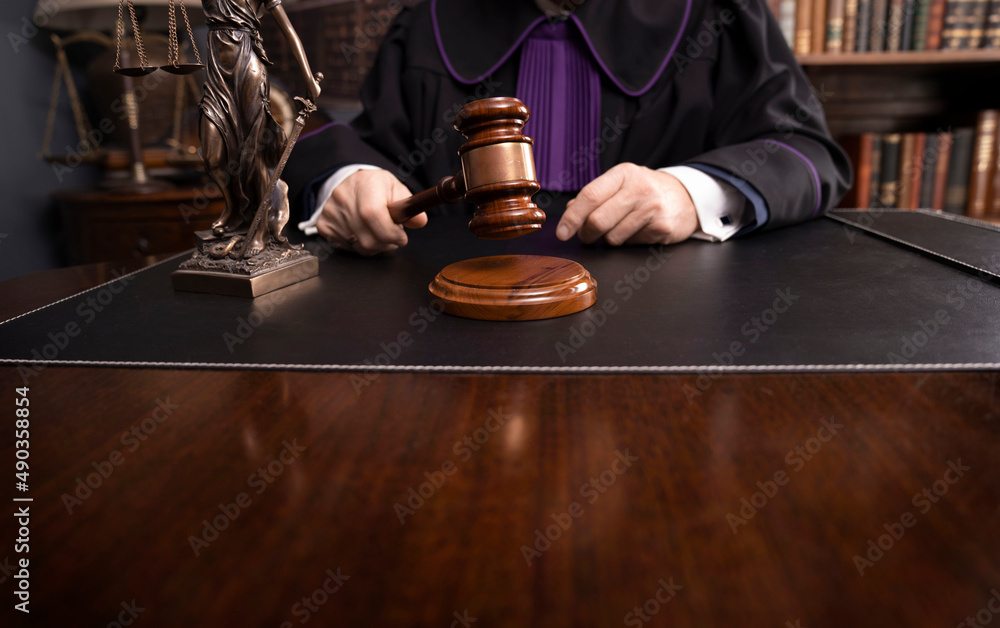 Law and justice – judge in toga with the gavel during trial Stock Photo ...
