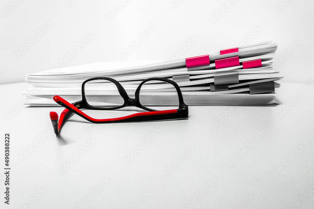 bundles bales of paper documents. stacks packs pile on the desk in the ...