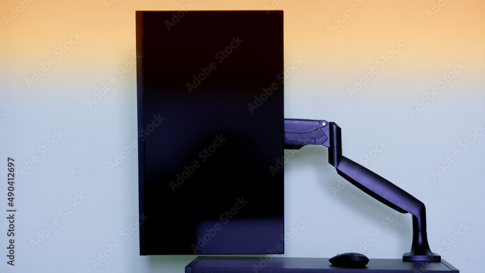 Foto de Modern matte computer monitor is installed in a vertical ...