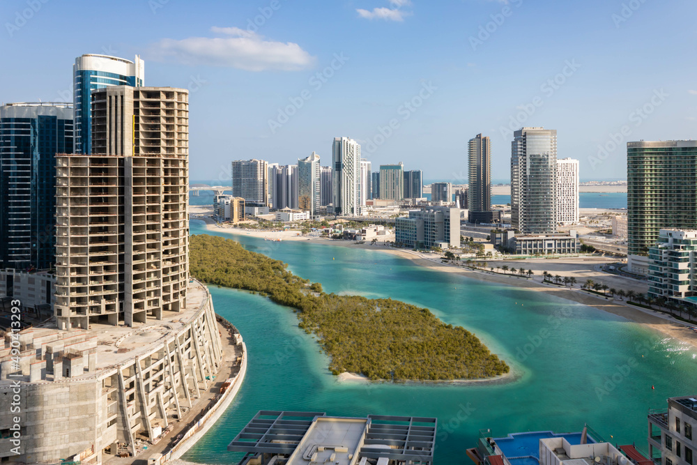 Aerial view of Reem Island in Abu Dhabi with mangrove trees and modern ...