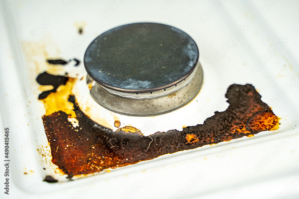 Dirty surface of kitchen gas stove with grease and soot. Stock Photo ...