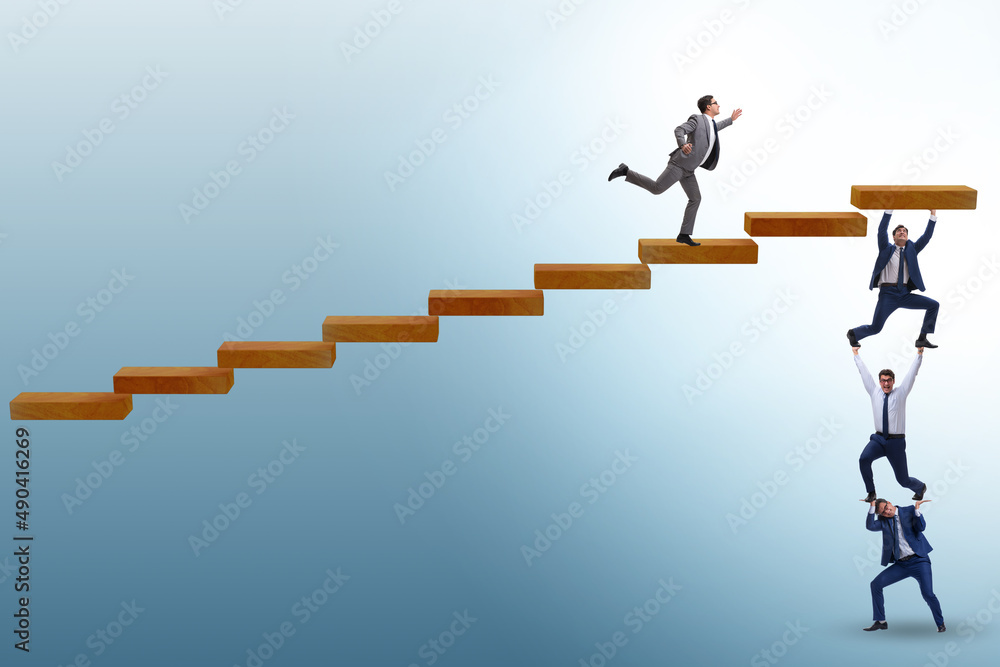 Teamwork concept with businessmen helping each other Stock Photo ...