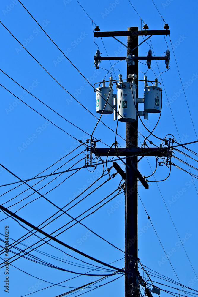 Transmission lines at top rung of pole with three step-down ...