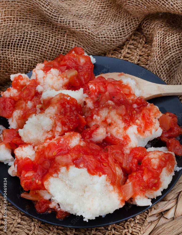 Traditional South African Pap and sous, maize meal covered in tomato ...