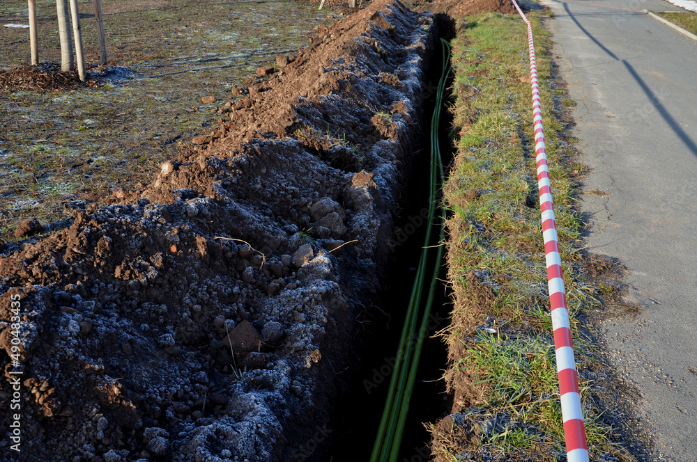 laying high voltage cables ground. environment does not damage electric ...