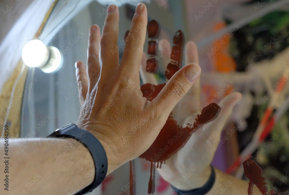 bloody hand touching a mirror in amsterdam Stock Photo | Adobe Stock