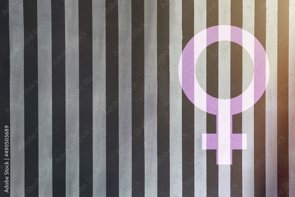 Elevated view over a road intersection with a symbol of woman gender ...