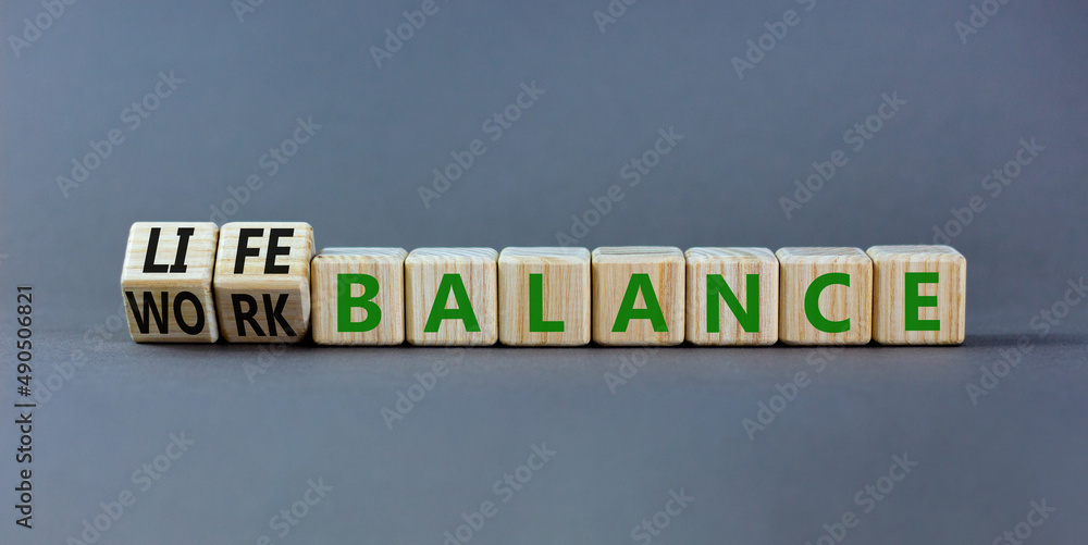 Work life balance symbol. Turned wooden cubes and changed concept words ...