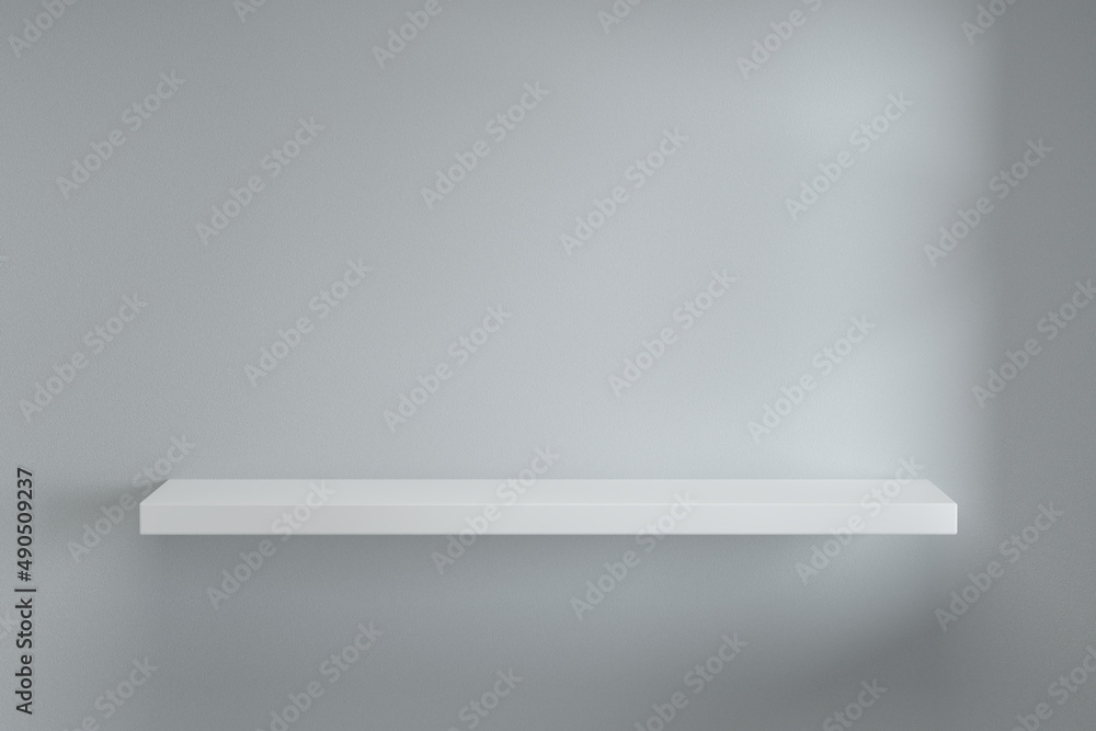Front view of an empty white shelf on a light blue textured wall ...