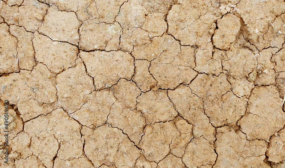 Cracked ground background in the top view for graphic design or ...