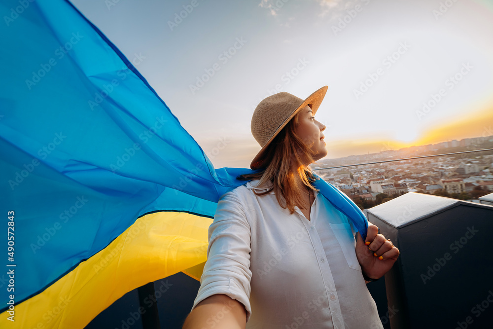 Pray For Ukraine A Woman Stands With The National Ukrainian Flag And pray-for-ukraine-a-woman-stands-with-the-national-ukrainian-flag-and