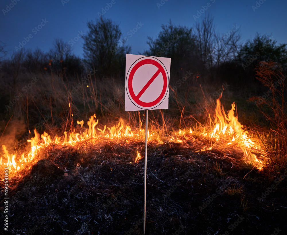 Burning grass and do not do it symbol with red diagonal line inside the ...