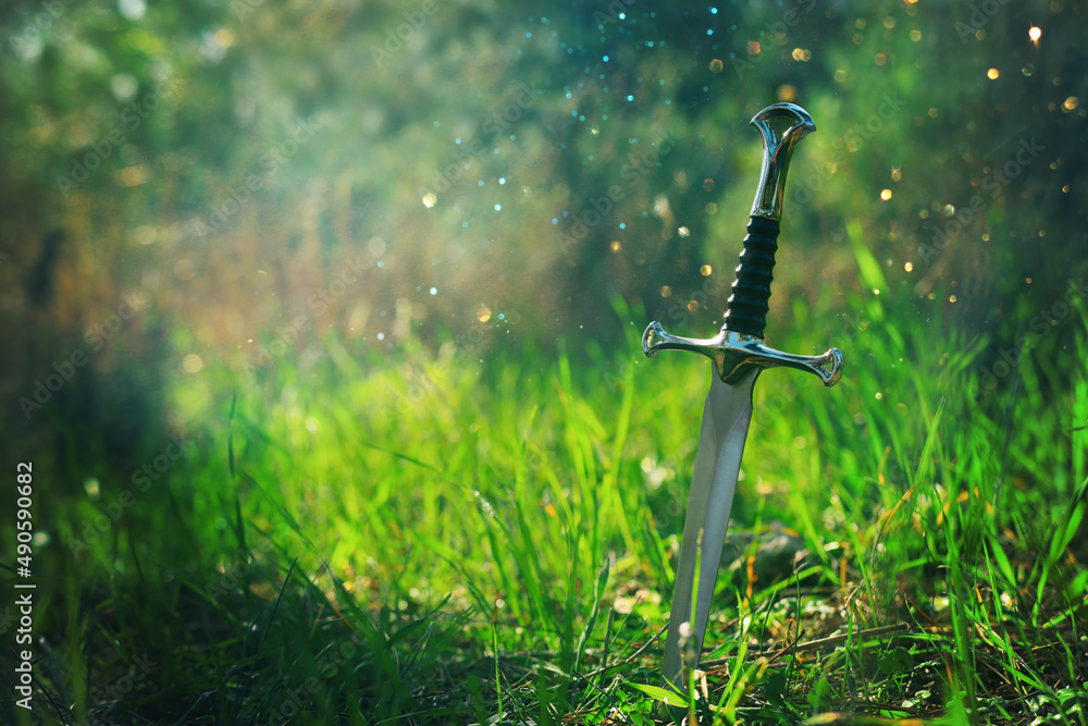 mysterious and magical photo of silver sword in the England woods and ...