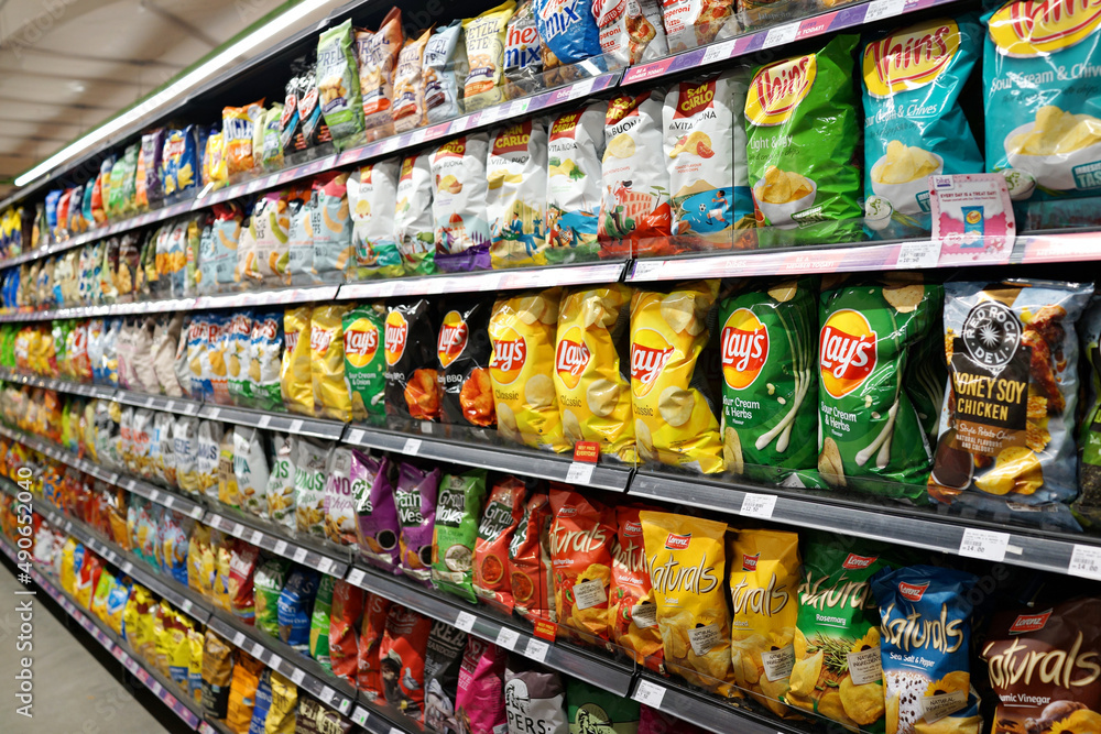 SELANGOR, MALAYSIA - 27 FEB 2022. Various brands of flavoured chips and ...