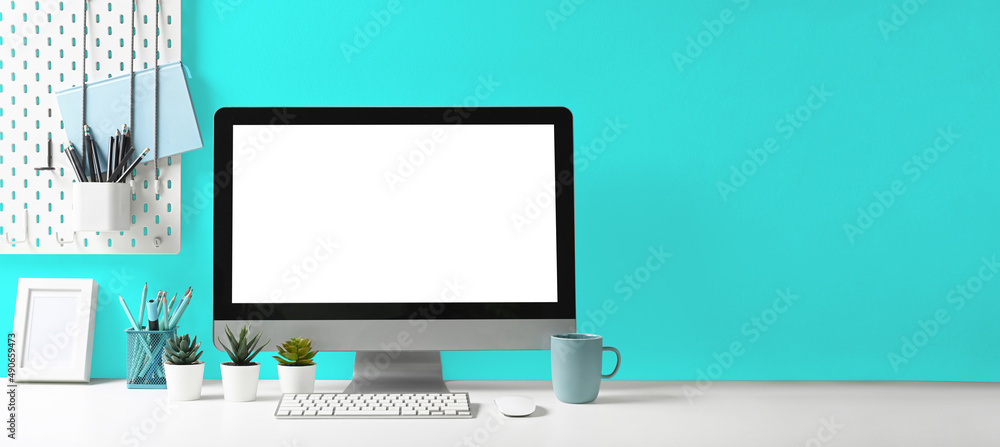 Front view computer pc and office supplies on white table with light ...