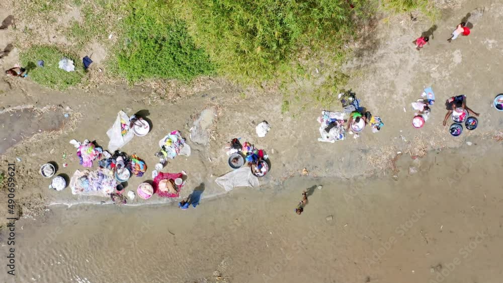 Haitian People Doing The Laundry By The Dajabon River, Also Called ...