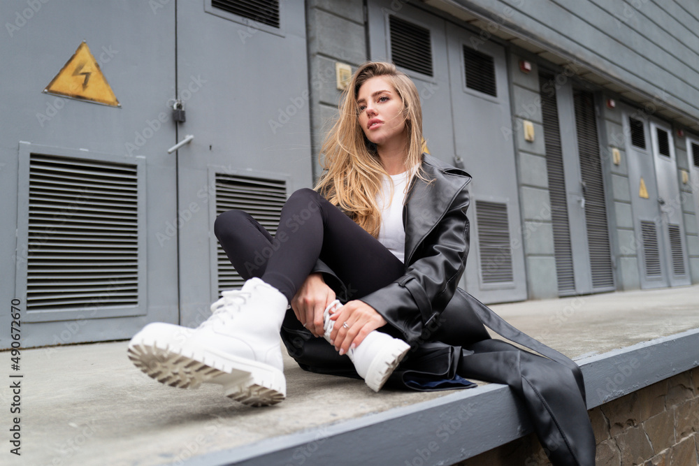 Beautiful female model in summer city in Europe. Trendy woman posing on ...