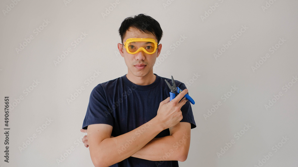engineering man standing holding tools at work isolated white ...