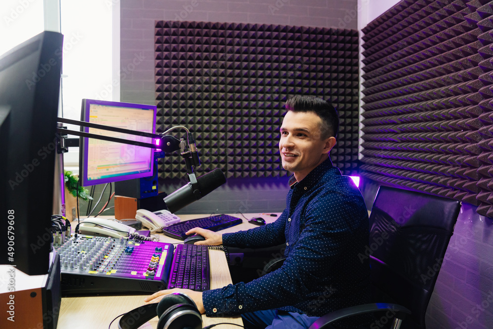 a radio host conducts a live broadcast in a professional radio studio ...