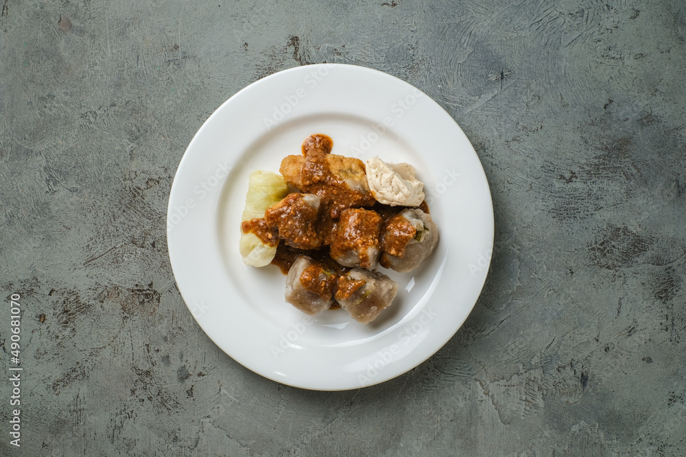 Siomay, Indonesian traditional street food with spicy peanut sauce ...