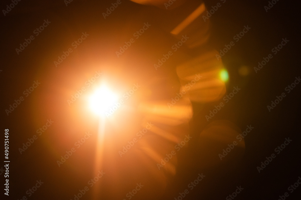 Solar lens flare on black background Stock Photo | Adobe Stock