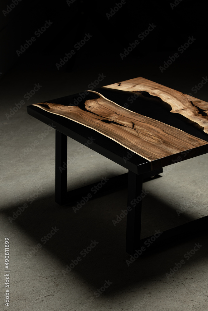 Expensive vintage furniture. The table is covered with epoxy resin and ...